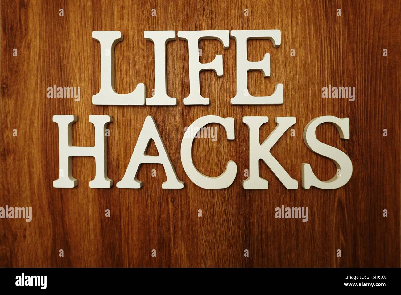 Life Hacks word alphabet letters on wooden background Stock Photo - Alamy