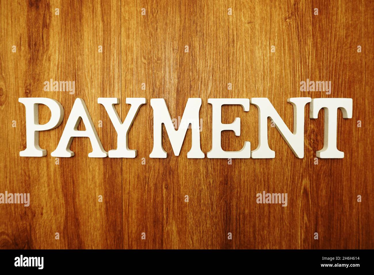 Payment word alphabet letters on wooden background Stock Photo - Alamy