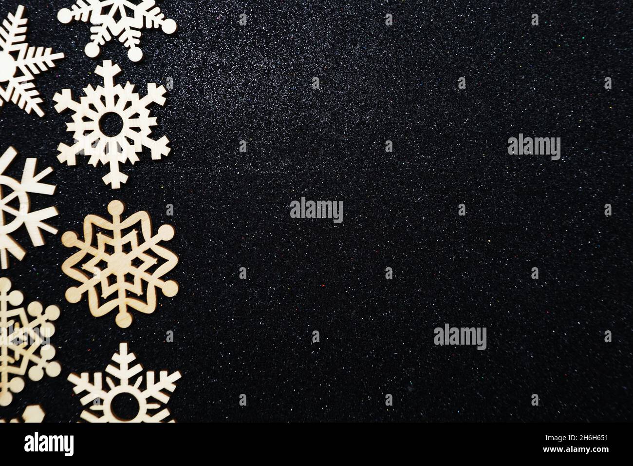 wooden snowflake border frame on black glitter background Stock Photo ...