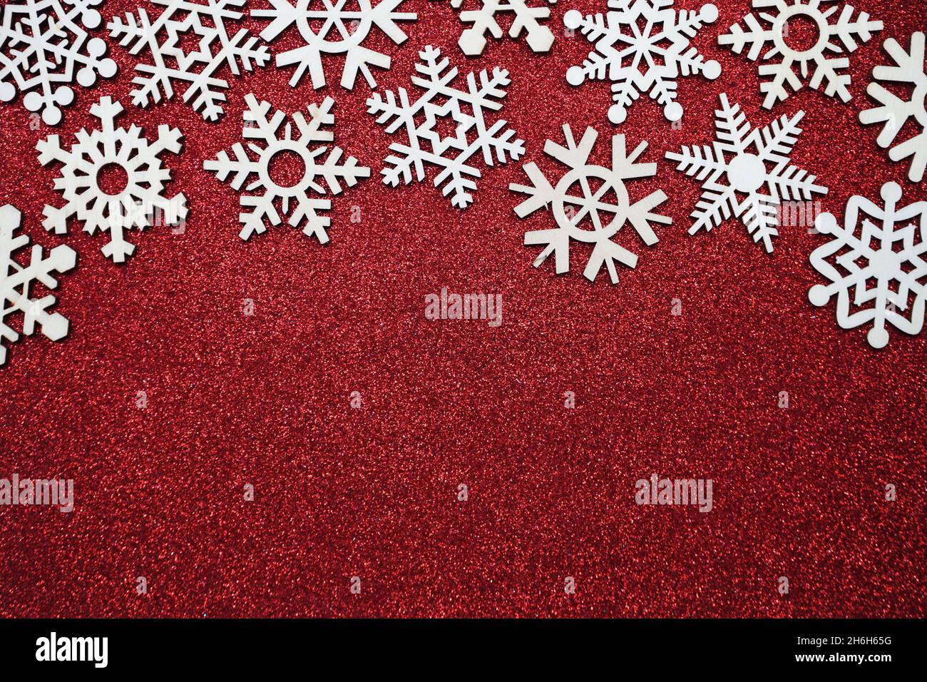 wooden snowflake border frame on red glitter background Stock Photo - Alamy