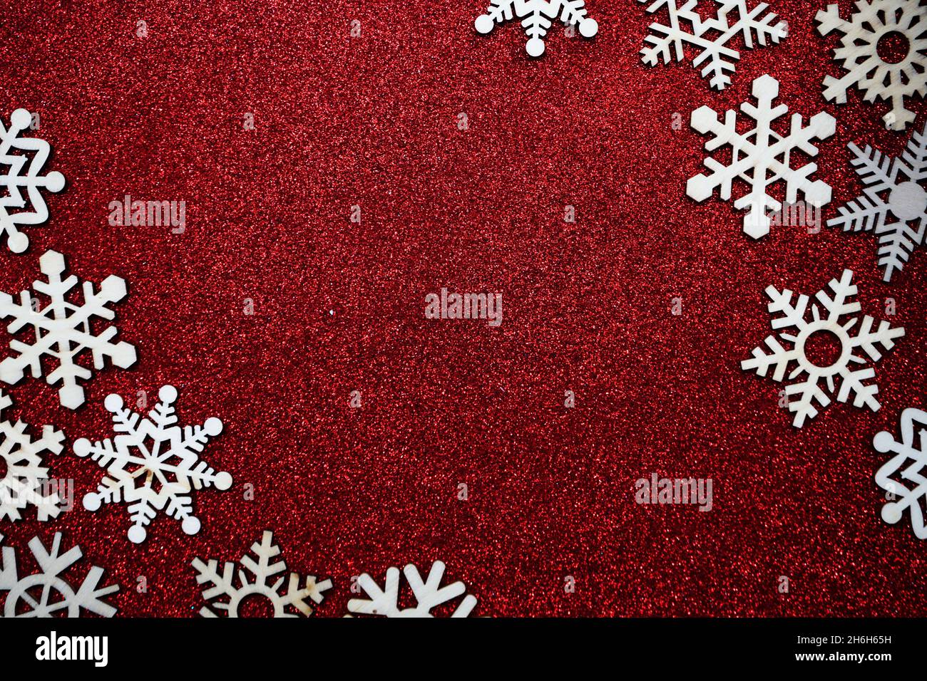 wooden snowflake border frame on red glitter background Stock Photo - Alamy