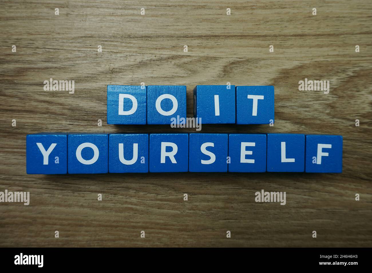 Do it yourself alphabet letter on wooden background Stock Photo - Alamy