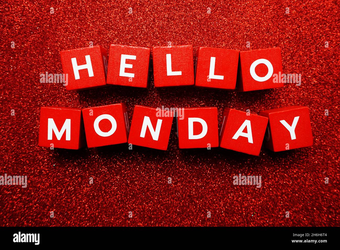 Hello Monday alphabet letter on red glitter background Stock Photo - Alamy