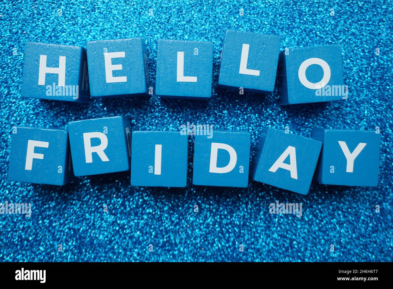 Hello Friday alphabet letter on blue glitter background Stock Photo - Alamy