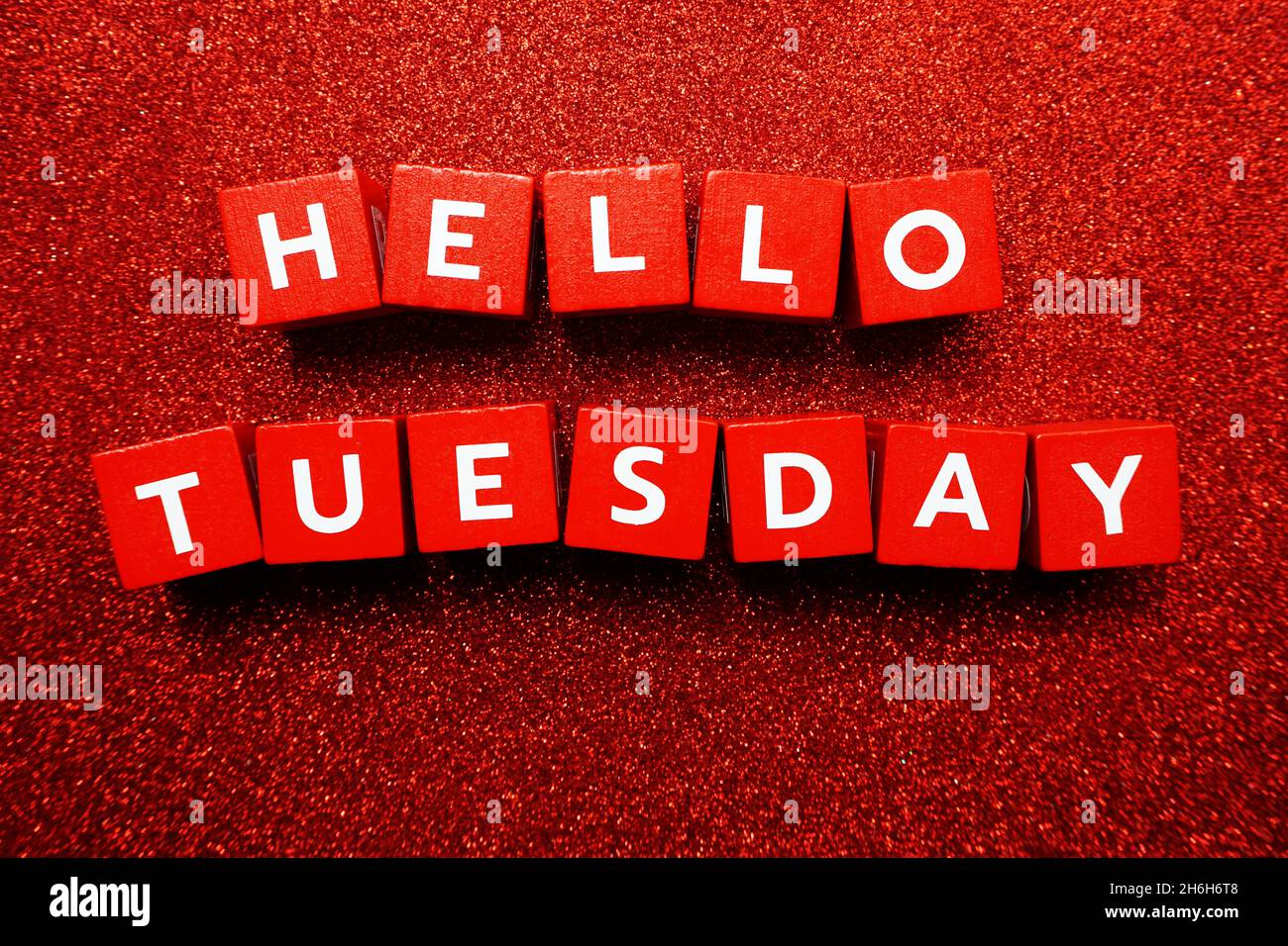 Hello Tuesday alphabet letter on red glitter background Stock Photo - Alamy