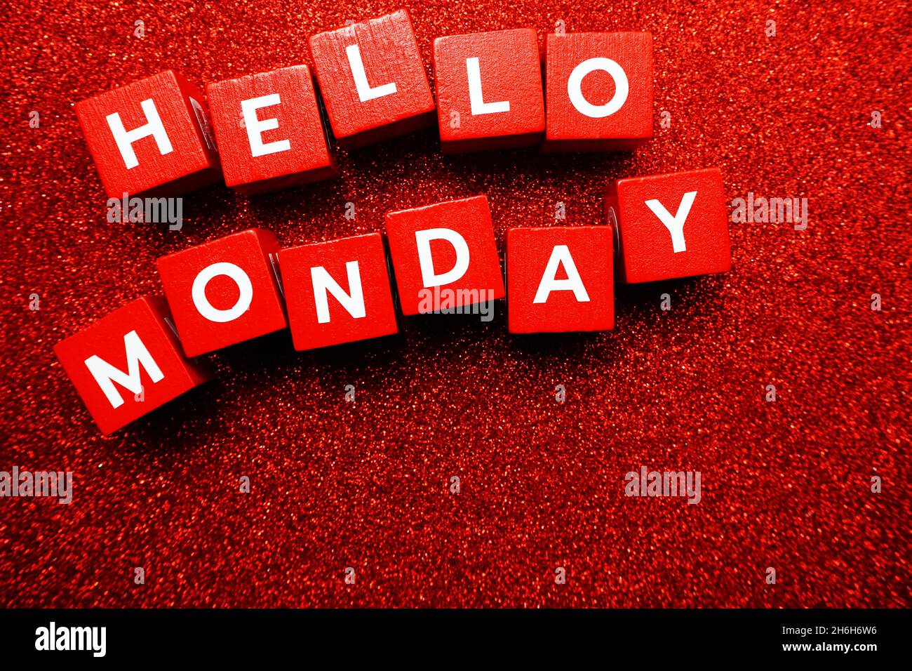 Hello Monday alphabet letter on red glitter background Stock Photo - Alamy