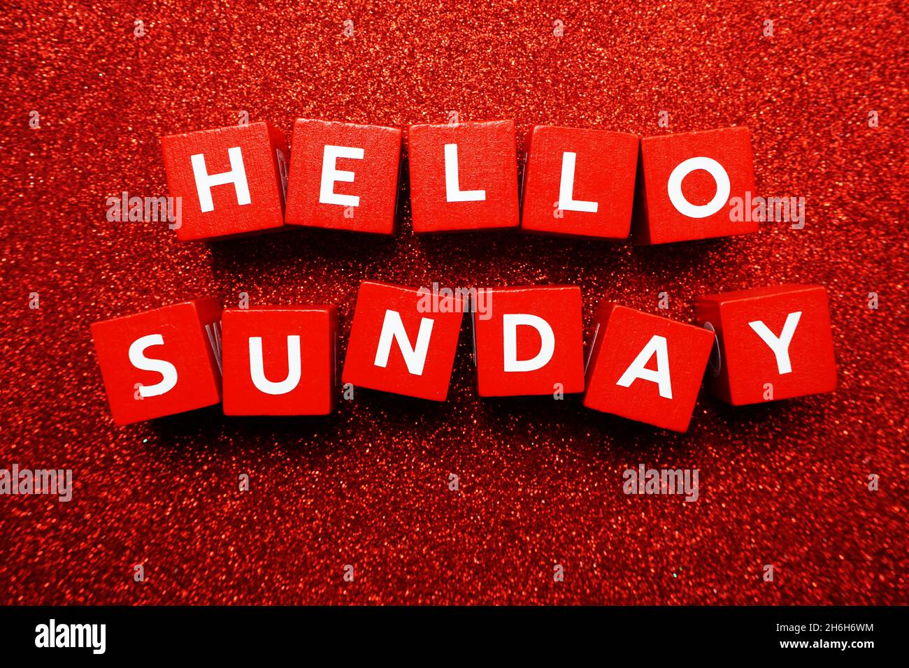Hello Sunday alphabet letter on red glitter background Stock Photo - Alamy