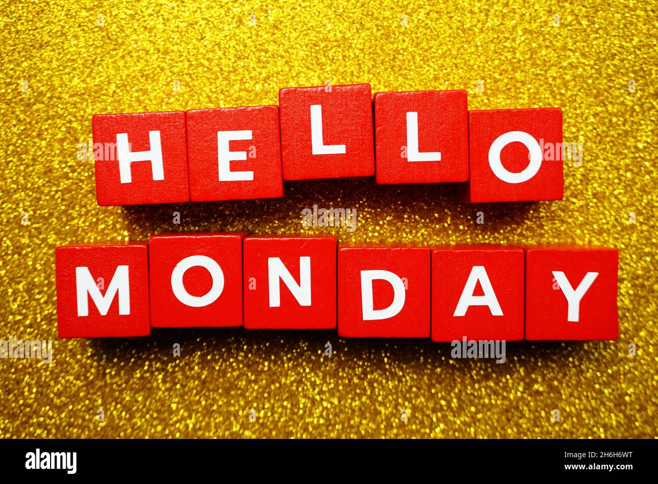 Hello Monday alphabet letter on yellow glitter background Stock Photo ...