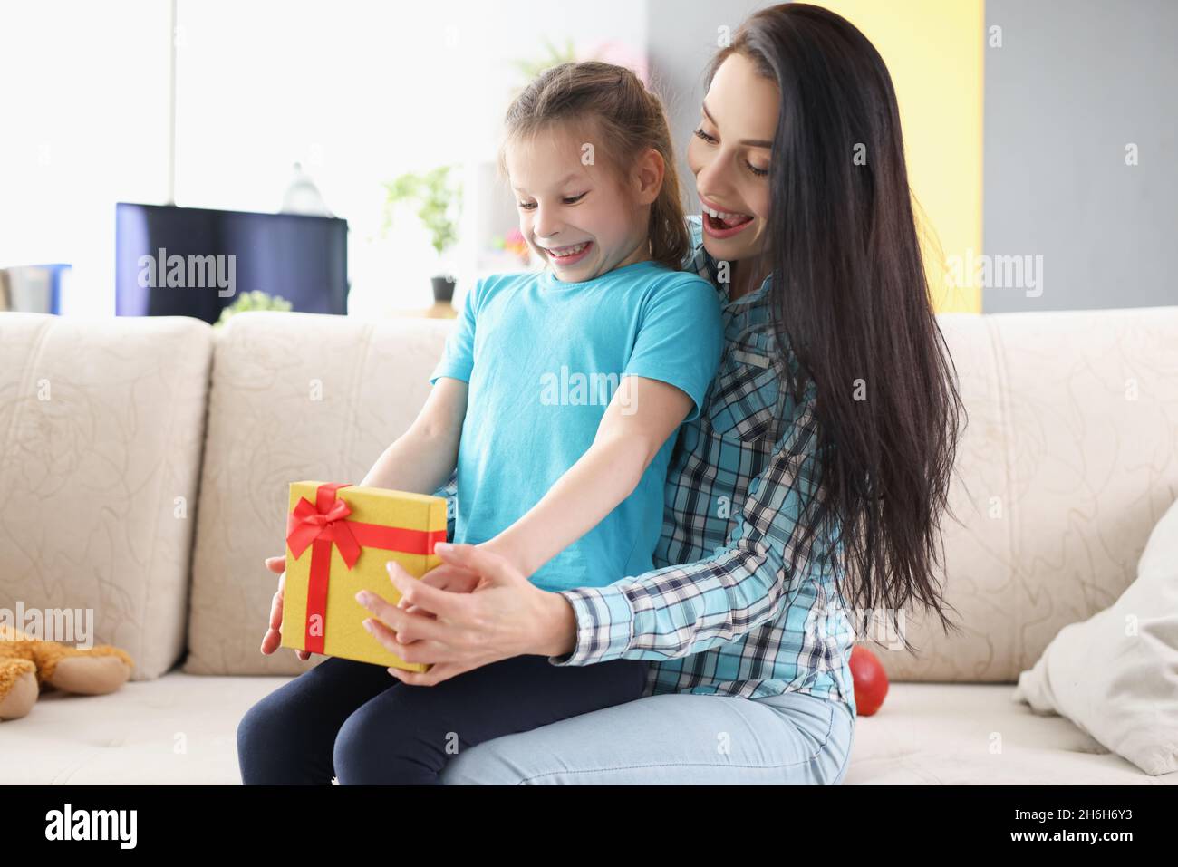 Cheerful child girl open present box and express happy emotions Stock ...