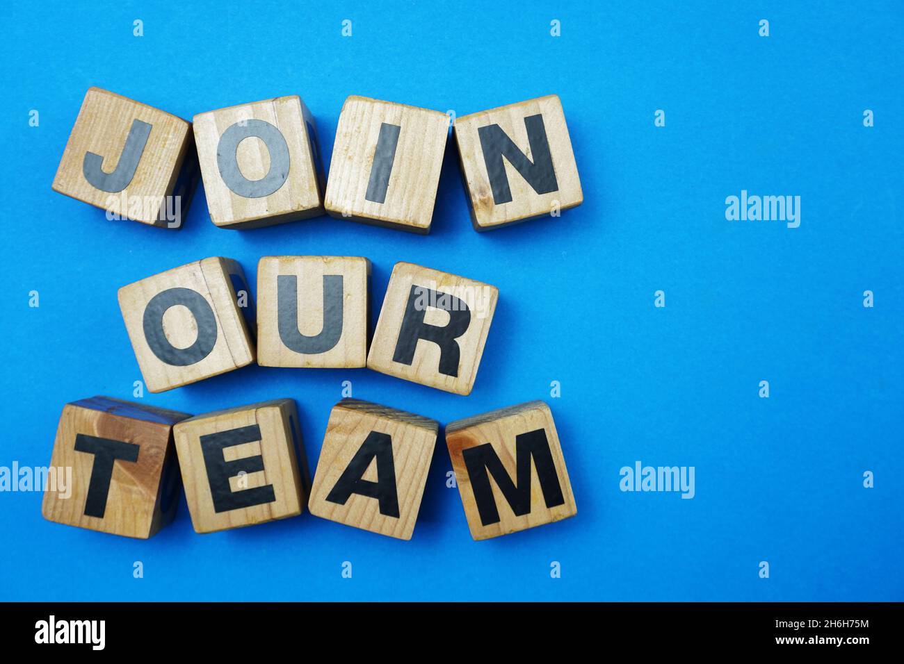 Top view Join our team alphabet letters on blue background Stock Photo ...