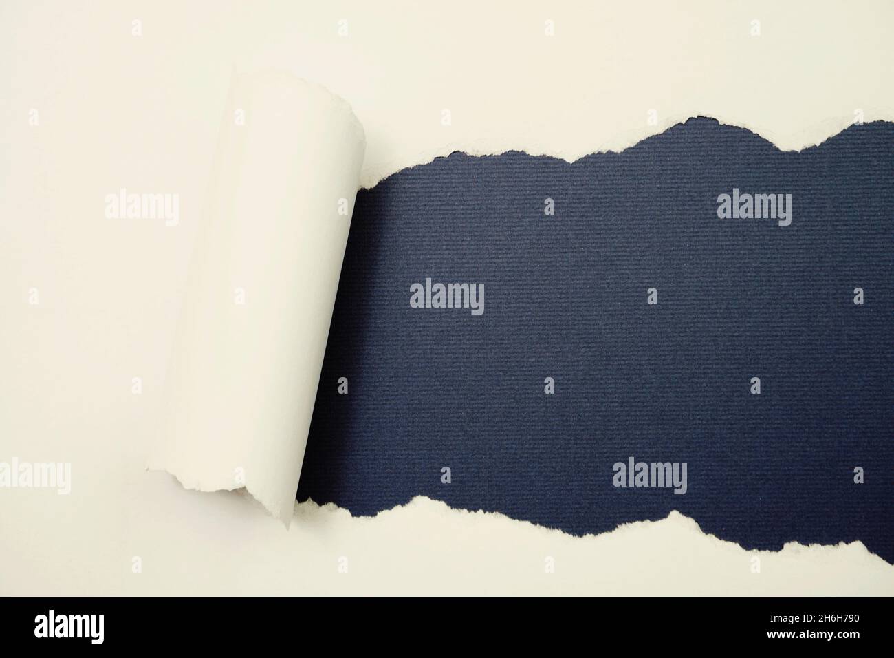 Paper torn with space copy on navy blue background Stock Photo - Alamy