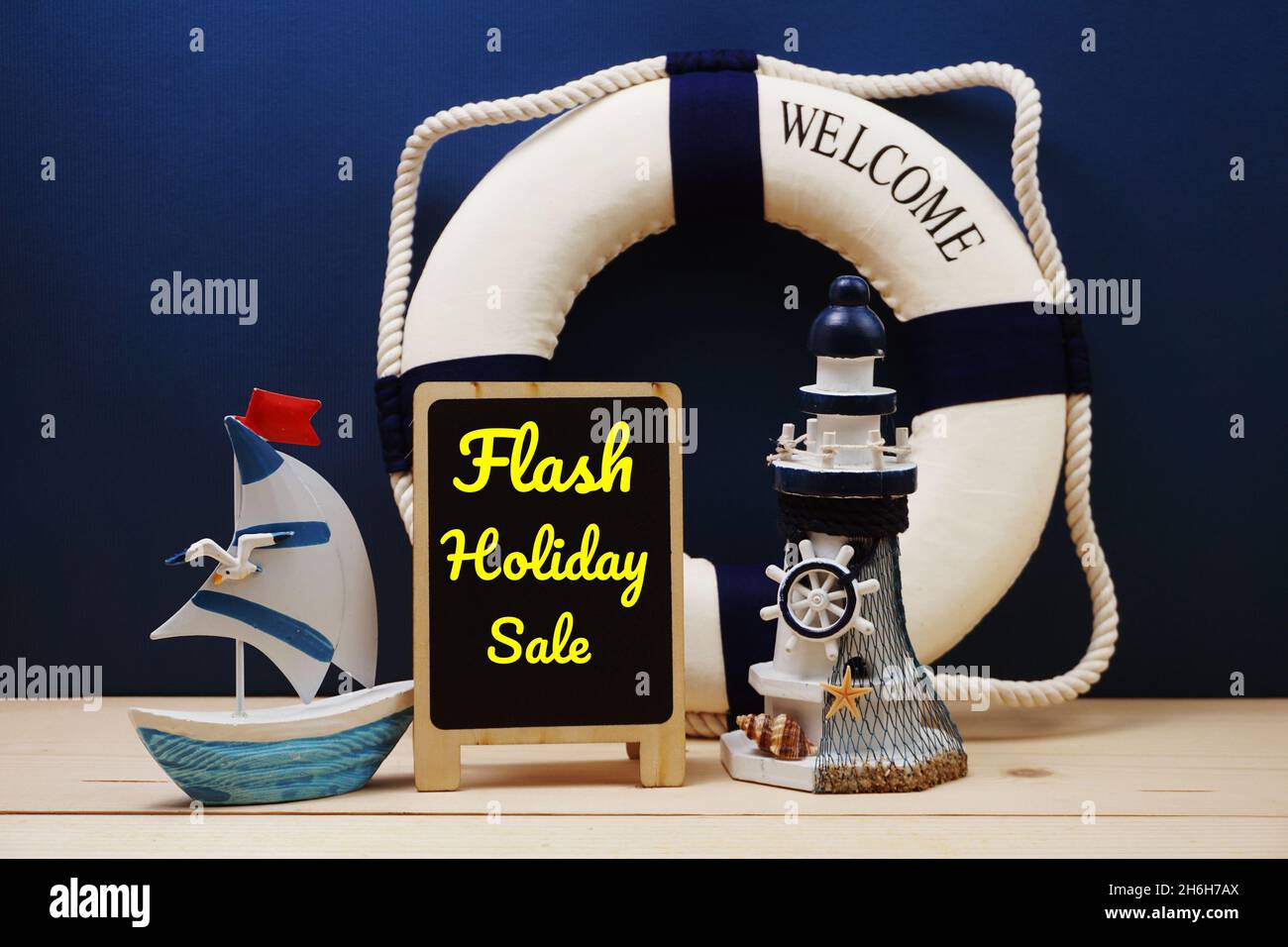 Flash Holiday Sale word on easel wooden board with Marine Decoration ...