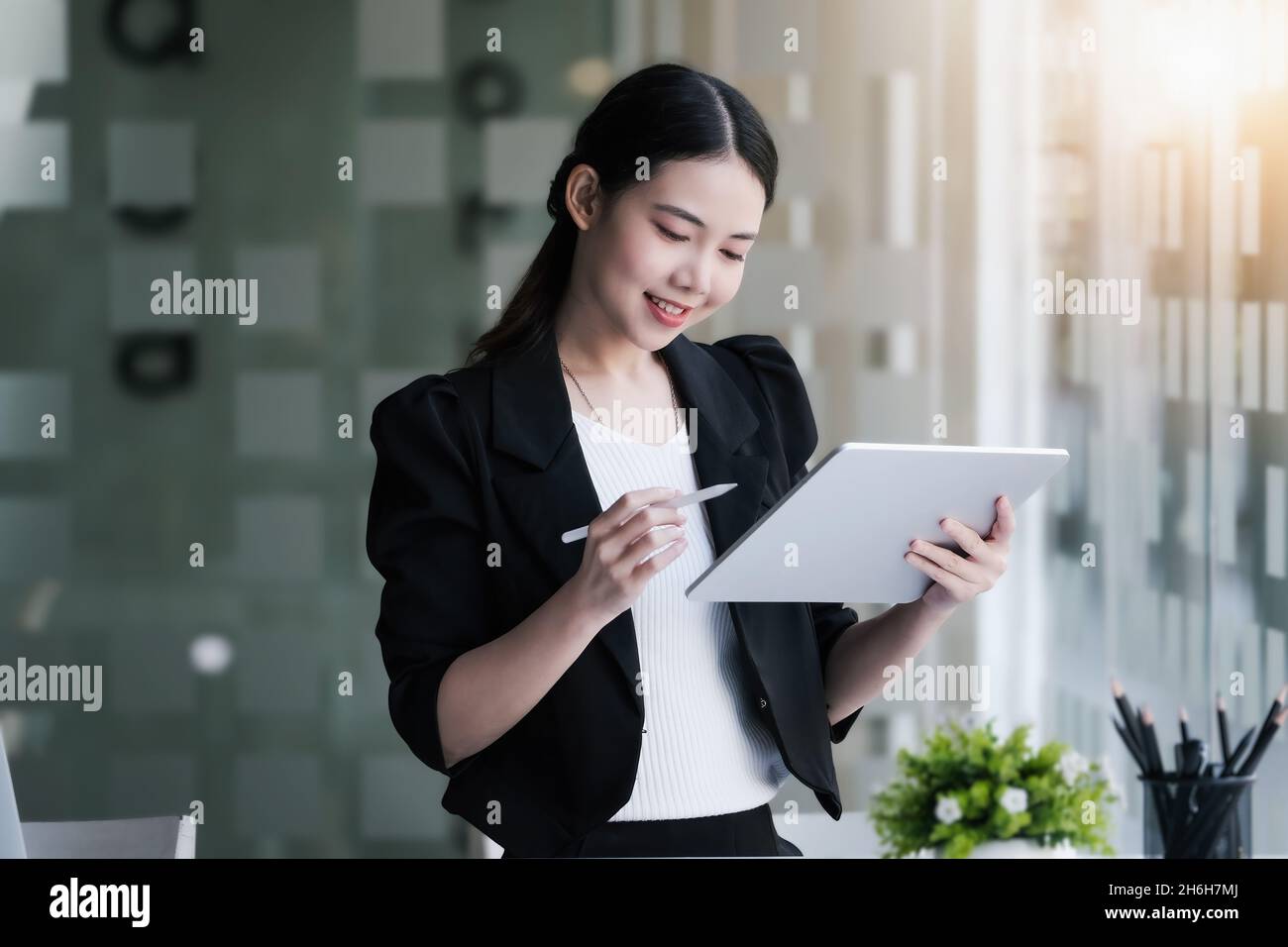 Business owners are using a computer tablet. in managing financial ...