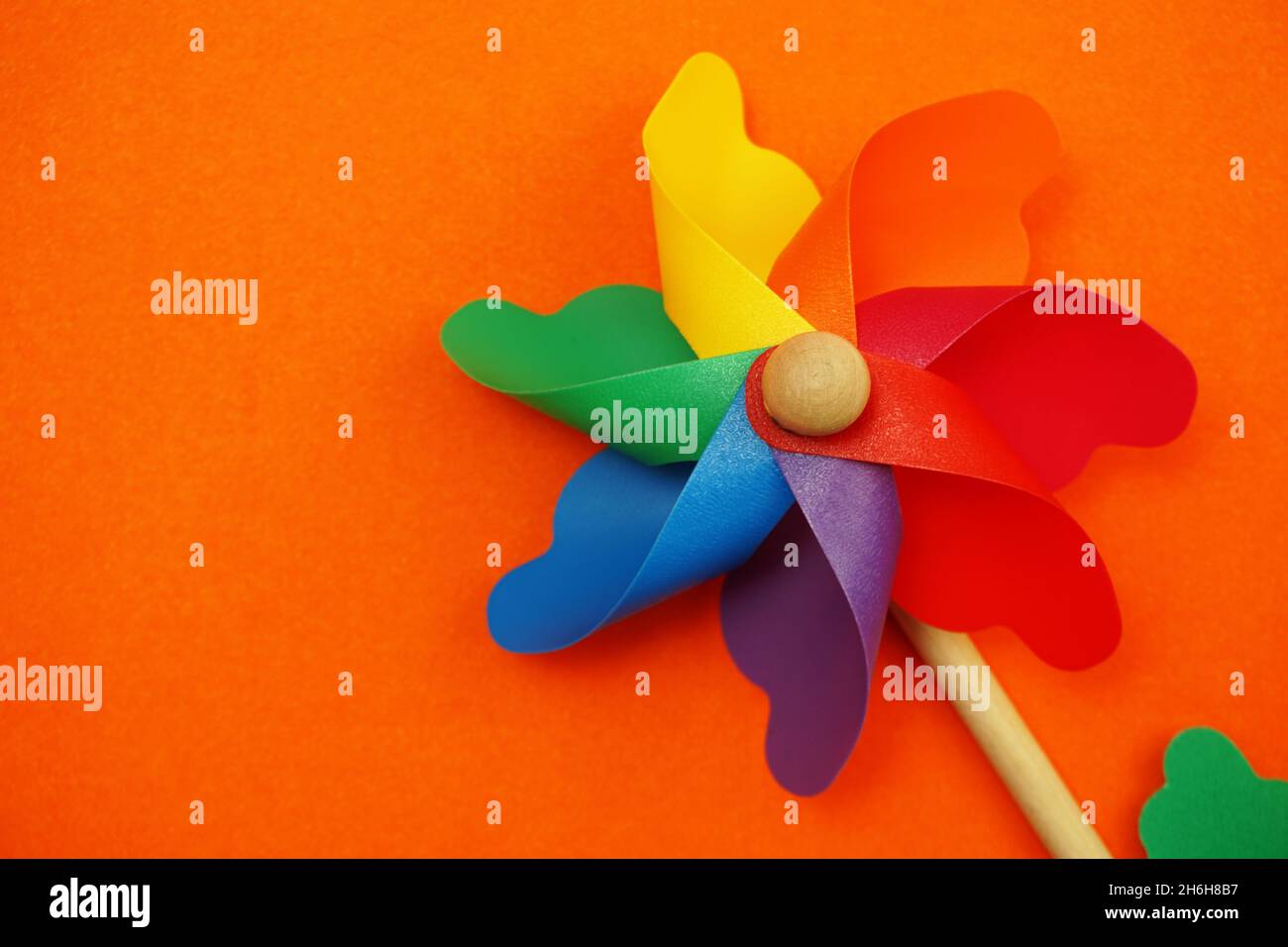 colorful pinwheel with space copy isolated on orange background Stock ...