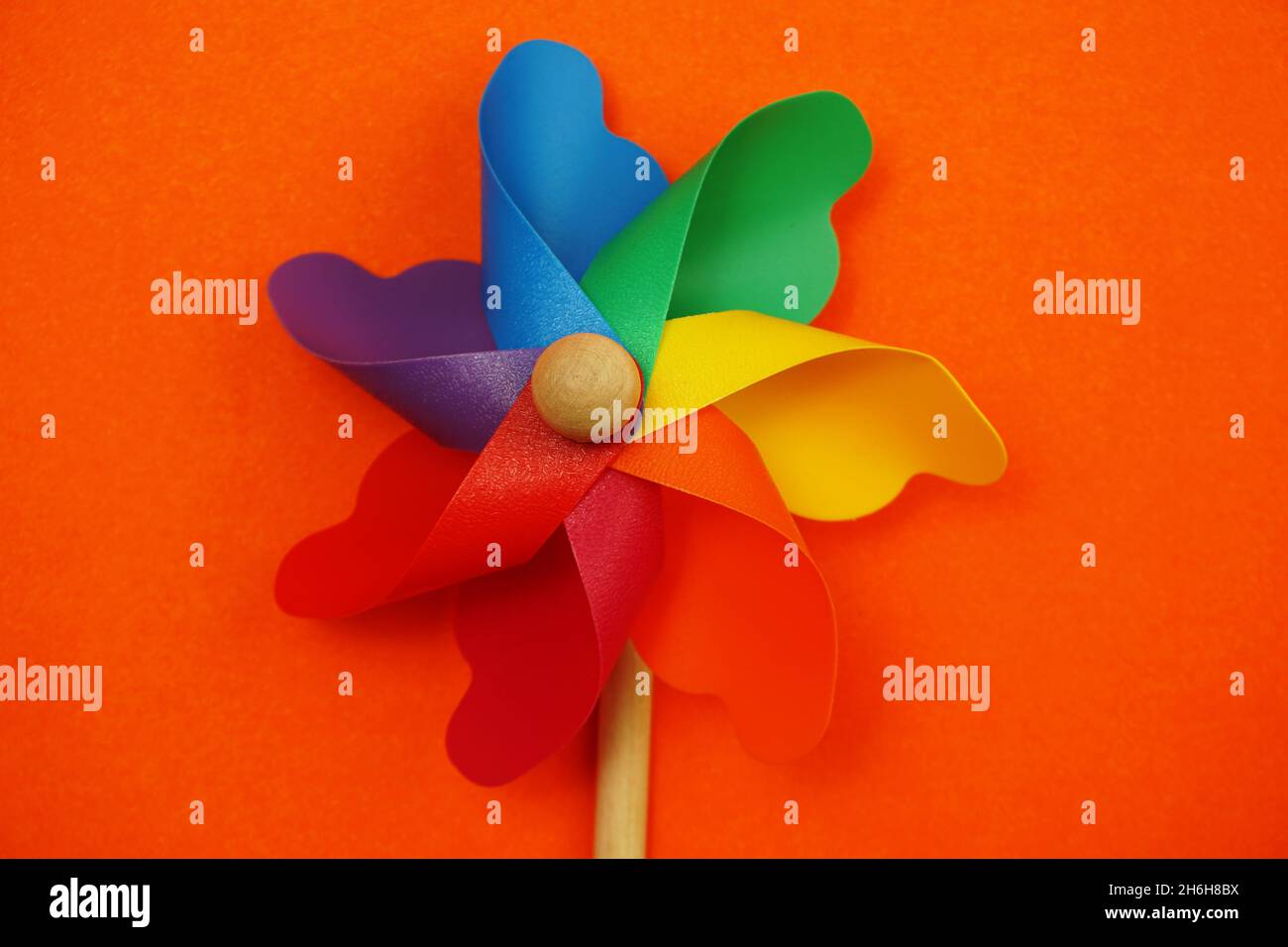 colorful pinwheel with space copy isolated on orange background Stock ...