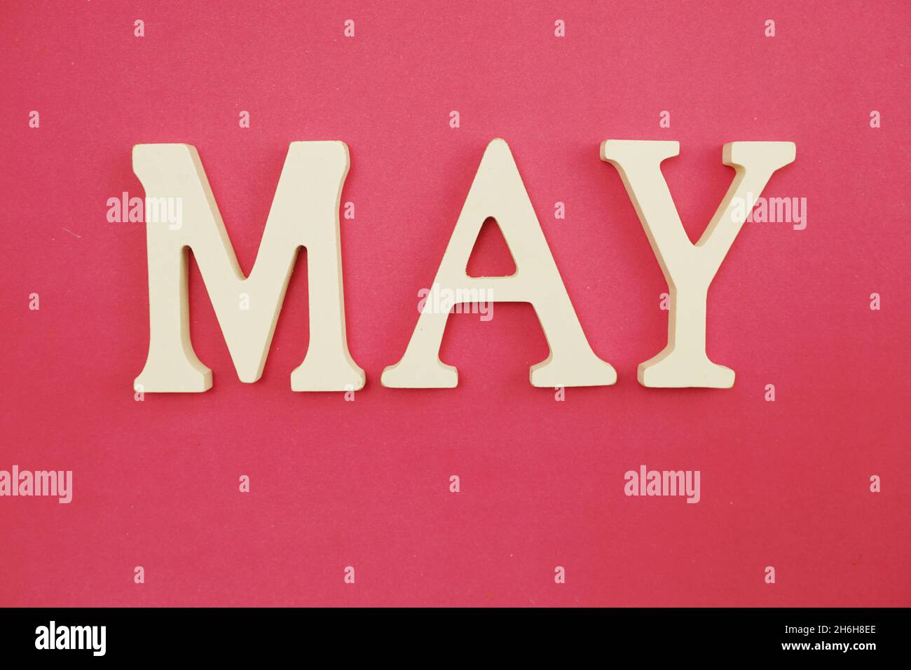 May alphabet letter with space copy on pink background Stock Photo - Alamy