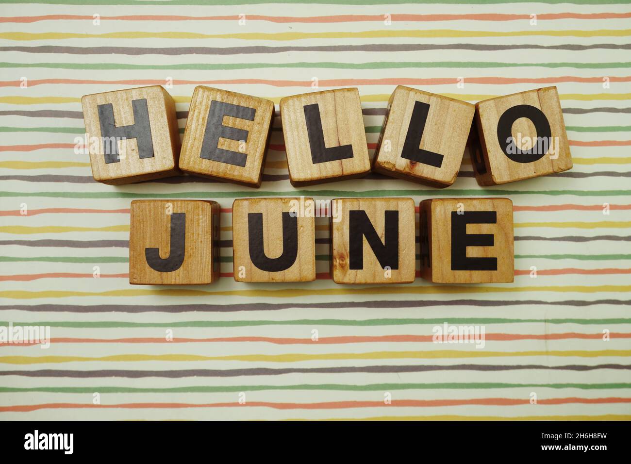 Hello June alphabet letters on colorful stripes background Stock Photo ...