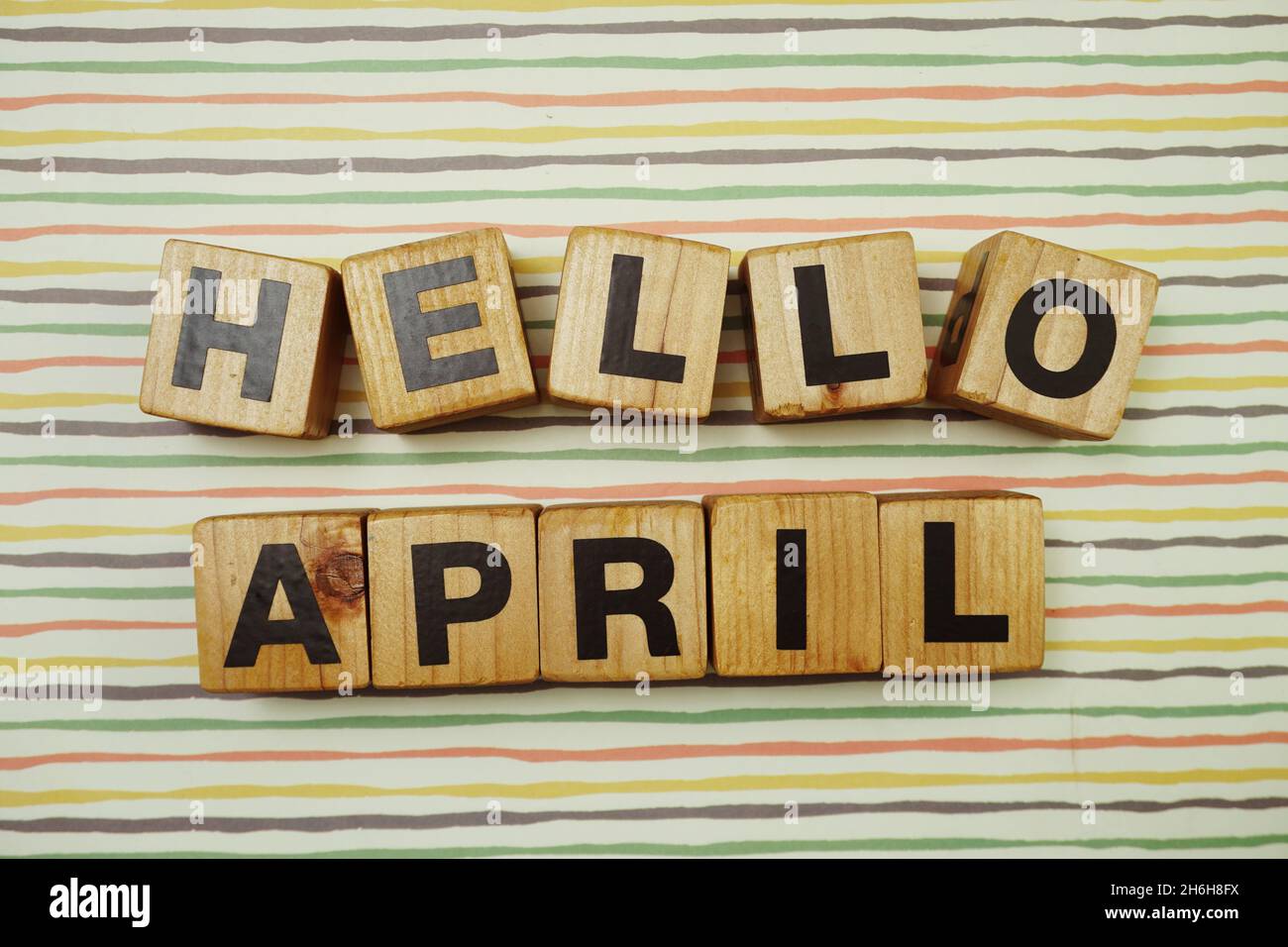 Hello April alphabet letters on colorful stripes background Stock Photo ...