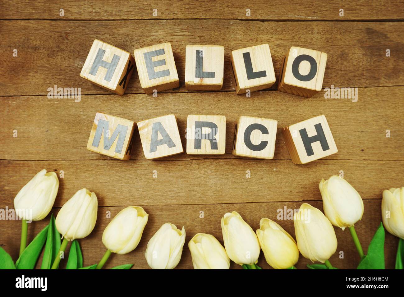 Hello March alphabet letters on wooden background Stock Photo - Alamy