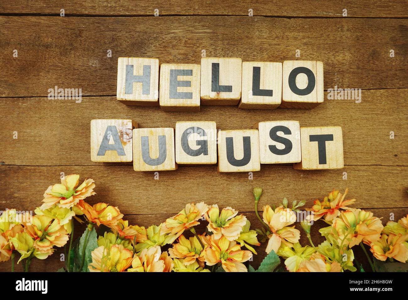 Hello August alphabet letters on wooden background Stock Photo - Alamy