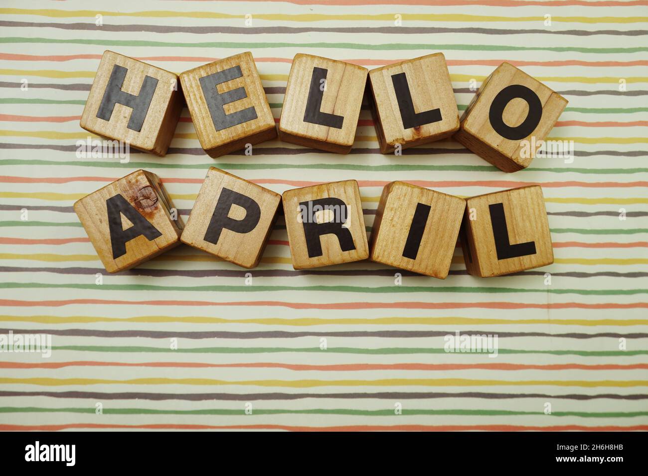 Hello April alphabet letters on colorful stripes background Stock Photo ...