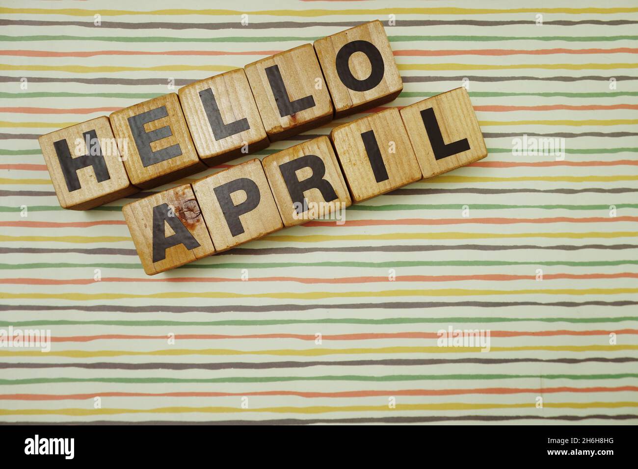 Hello April alphabet letters on colorful stripes background Stock Photo ...