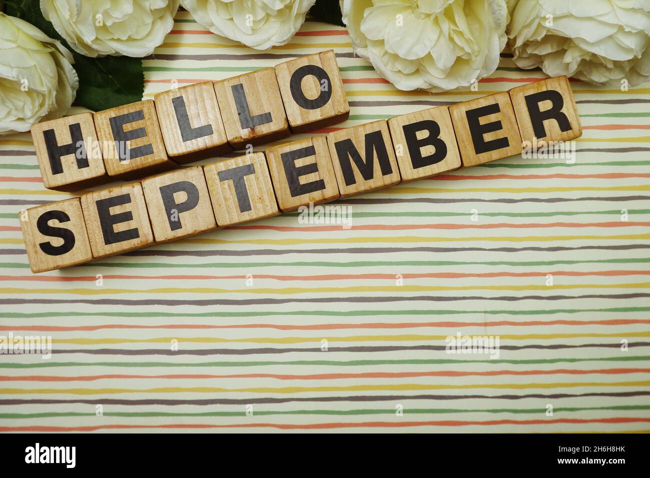Hello September alphabet letters with space copy on colorful Stripes ...