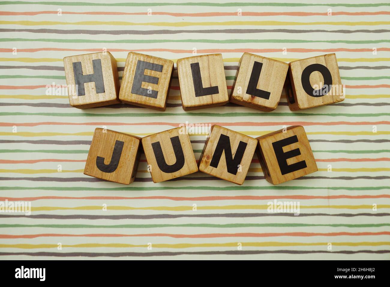 Hello June alphabet letters on colorful stripes background Stock Photo ...