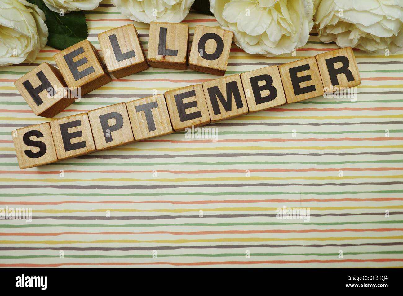 Hello September alphabet letters with space copy on colorful Stripes ...