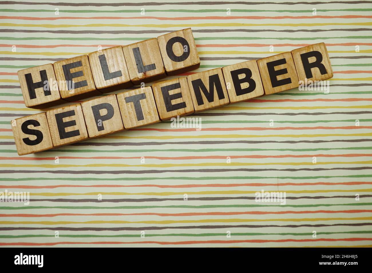 Hello September alphabet letters with space copy on colorful Stripes ...