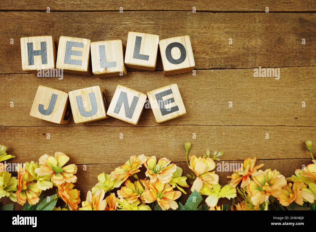 Hello June alphabet letters on wooden background Stock Photo - Alamy