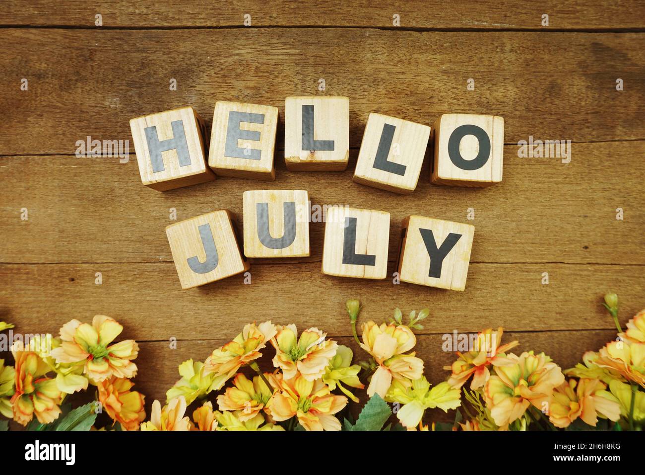 Hello July alphabet letters on wooden background Stock Photo - Alamy