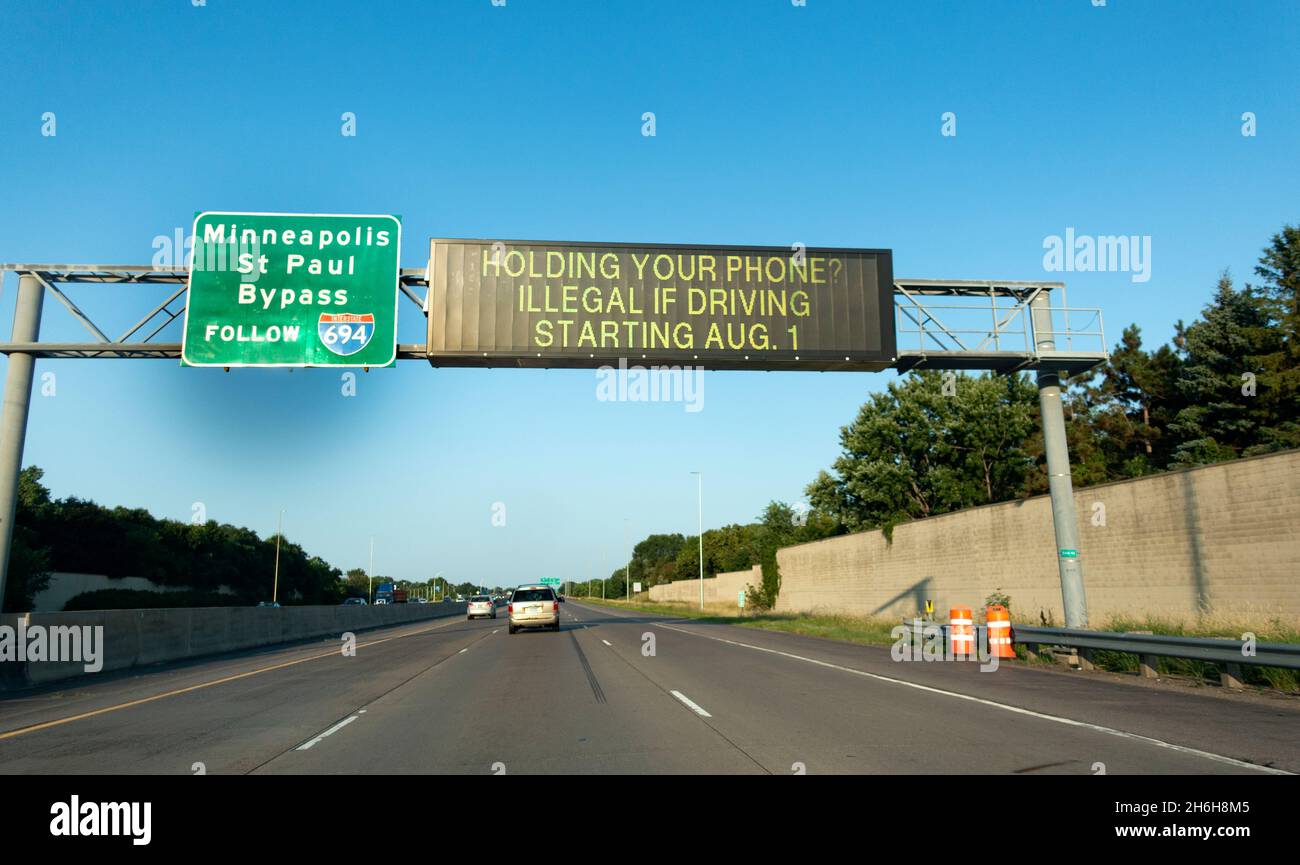Highway sign warning the use of cell phone while driving is illegal ...