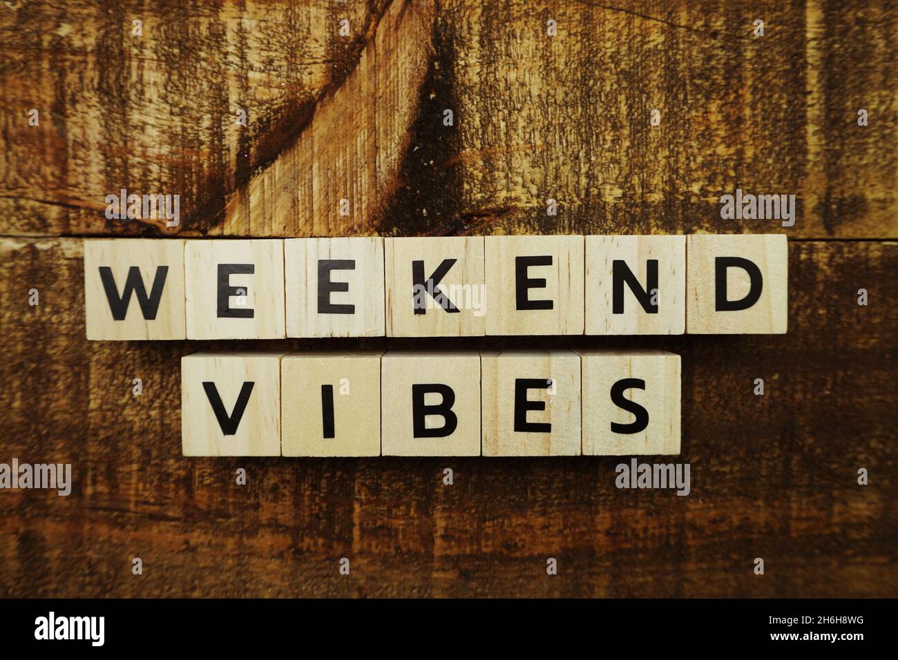 Weekend Vibes alphabet letters on wooden background Stock Photo - Alamy