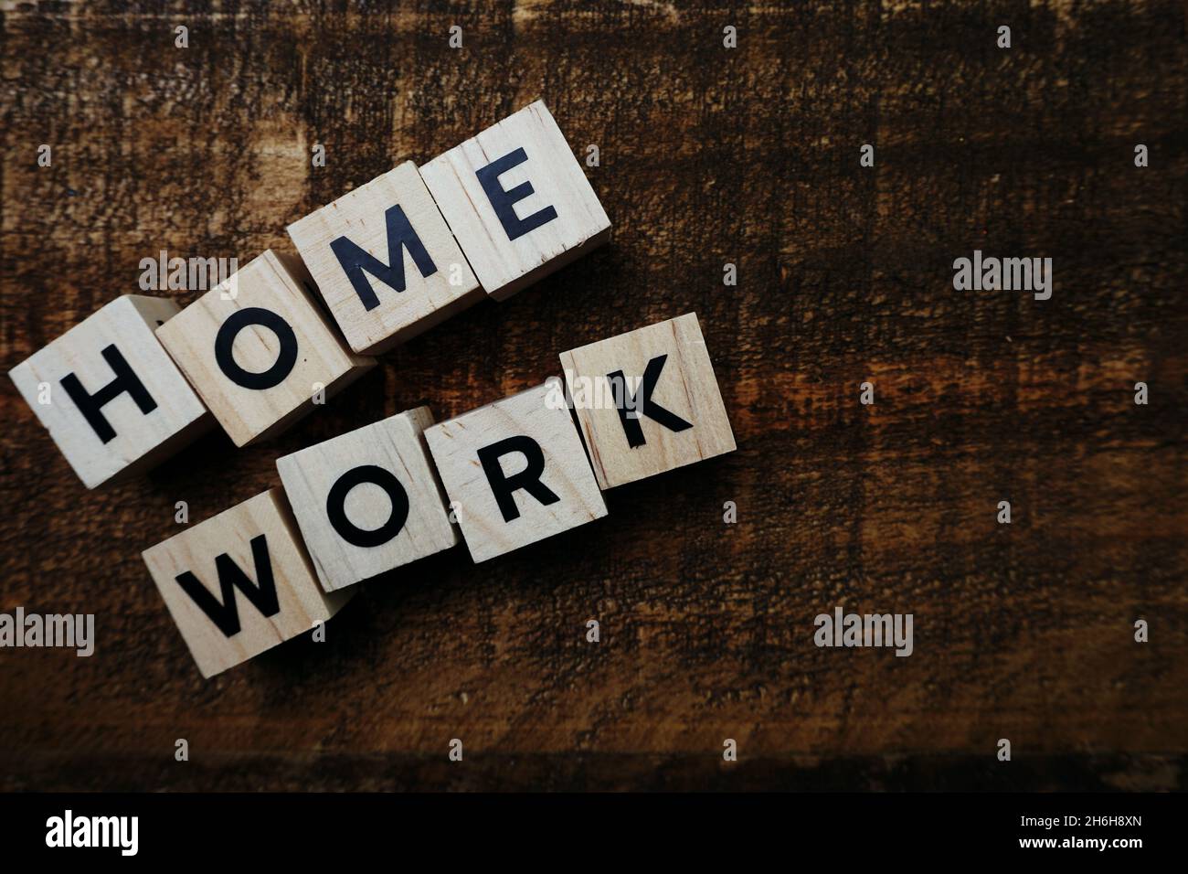 Home Work alphabet letters on wooden background Stock Photo - Alamy
