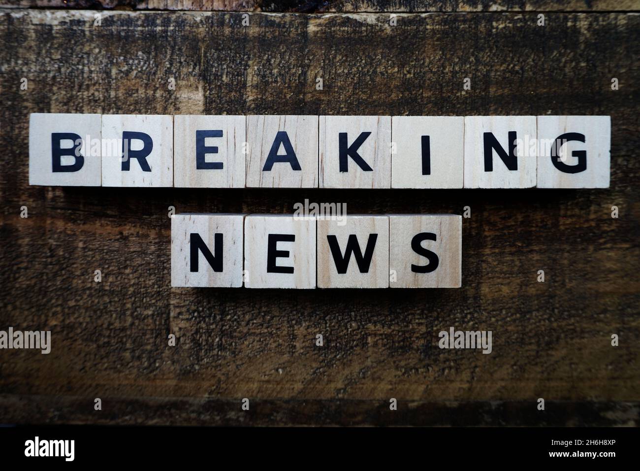 Breaking News alphabet letters on wooden background Stock Photo - Alamy