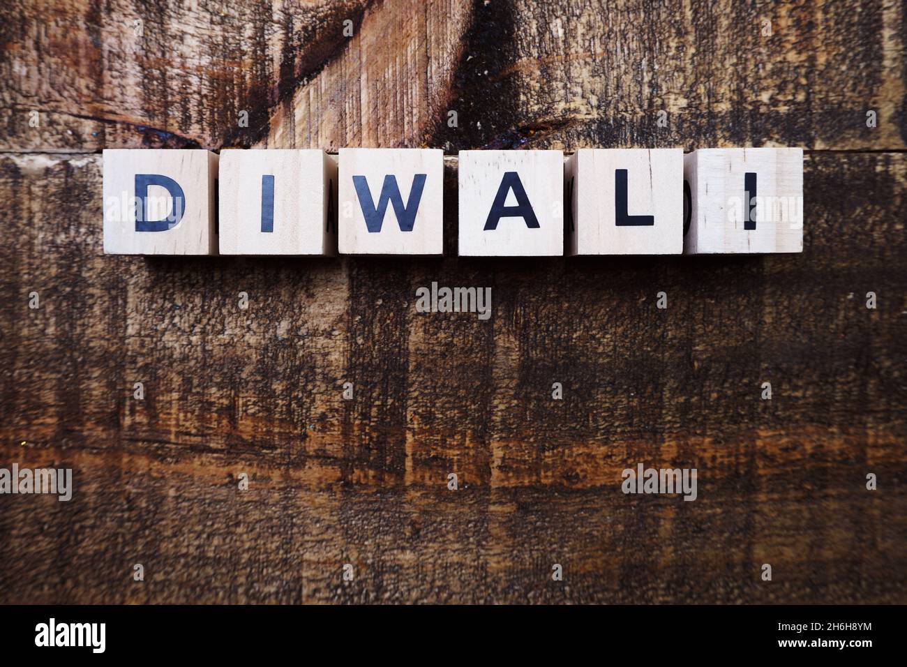 Diwali alphabet letter with space copy on wooden background Stock Photo ...