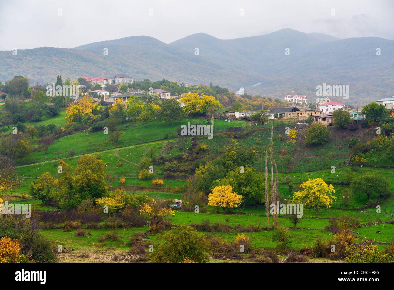 House of a mountain village with field and trees hi-res stock ...