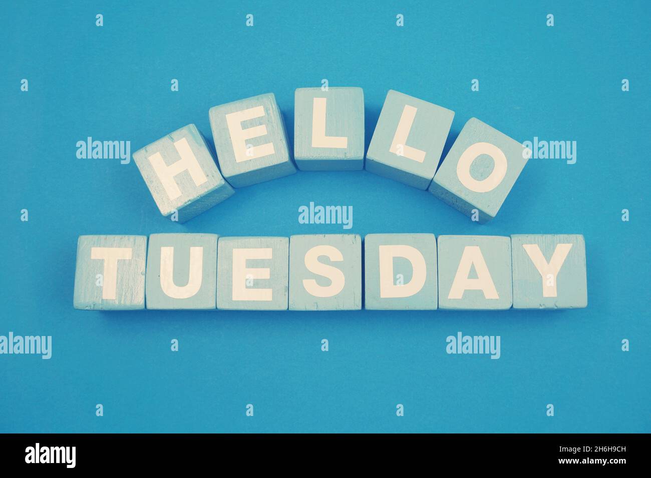 Hello Tuesday alphabet letters on blue background Stock Photo - Alamy