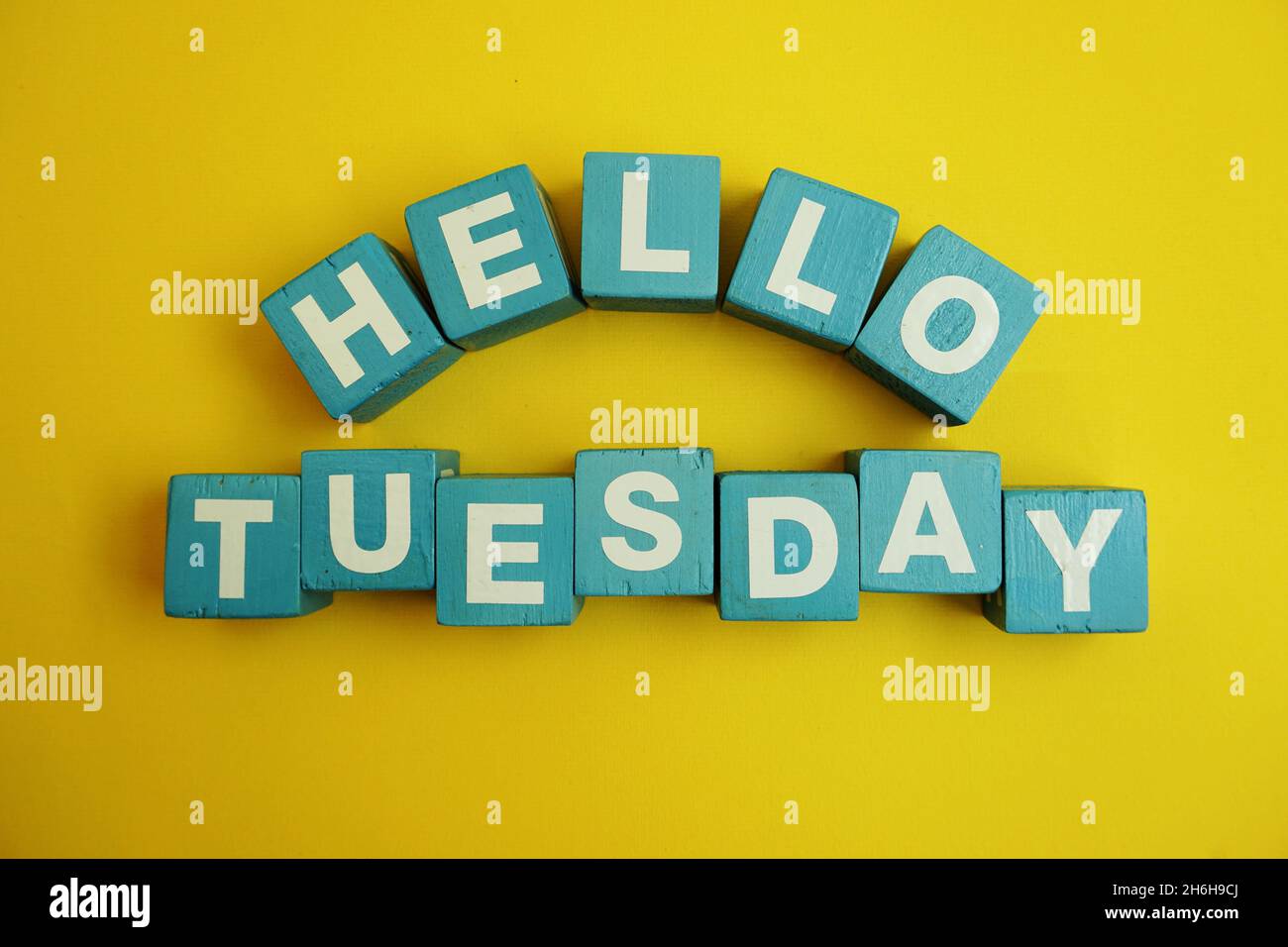 Hello Tuesday alphabet letters on yellow background Stock Photo - Alamy