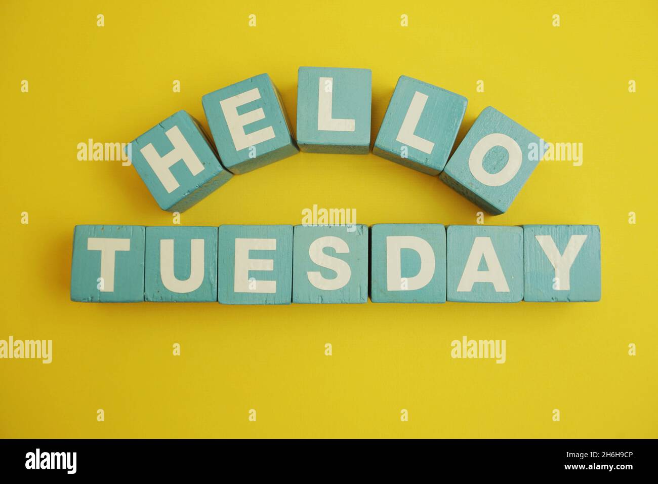 Hello Tuesday alphabet letters on yellow background Stock Photo - Alamy