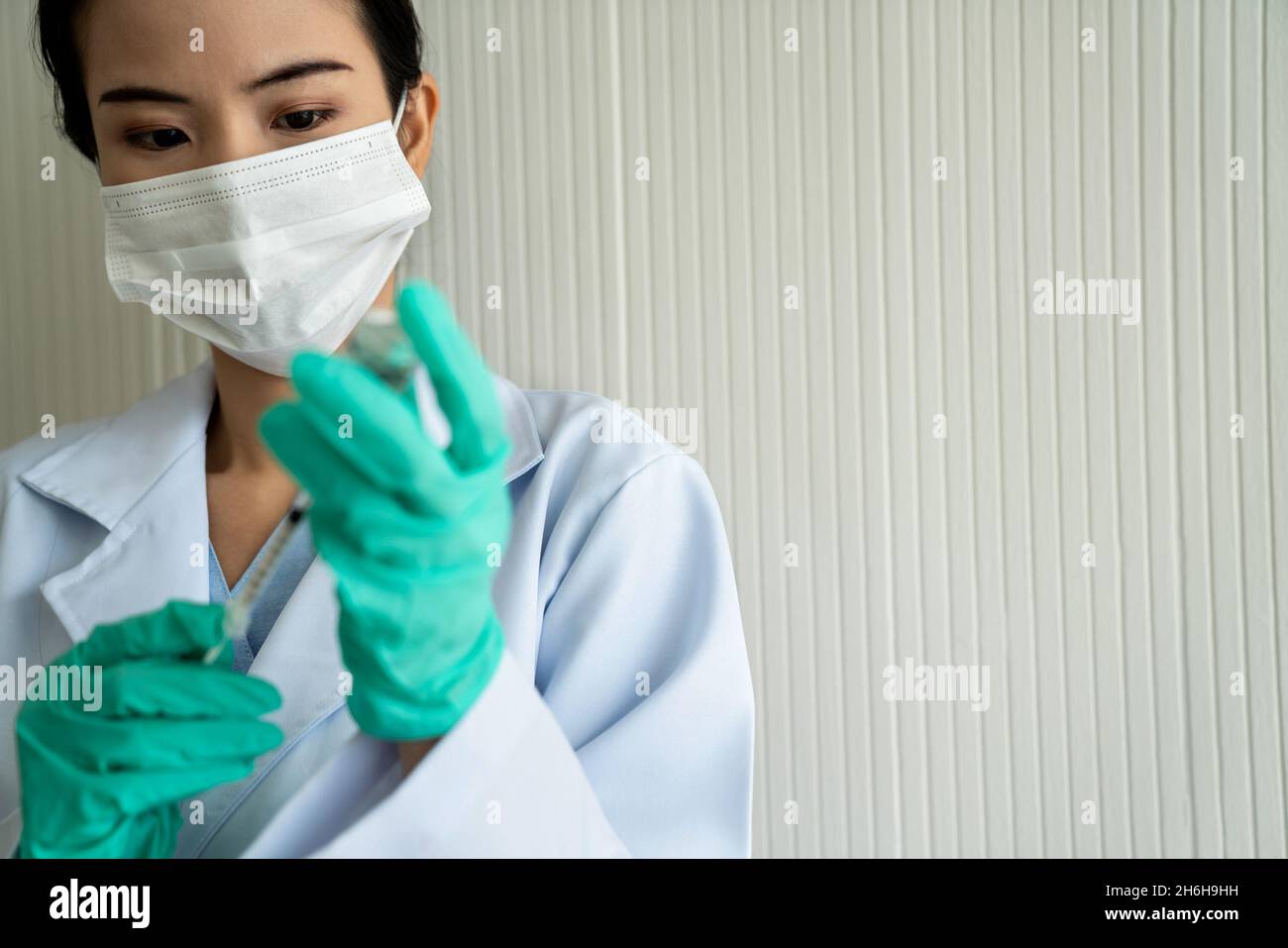 Skillful doctor prepare vaccine proficiently before injection . Covid ...