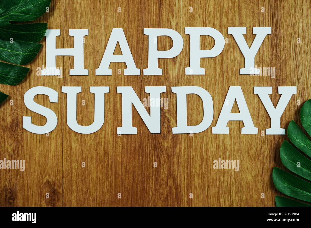 Happy Sunday alphabet letters Top view on wooden background Stock Photo ...