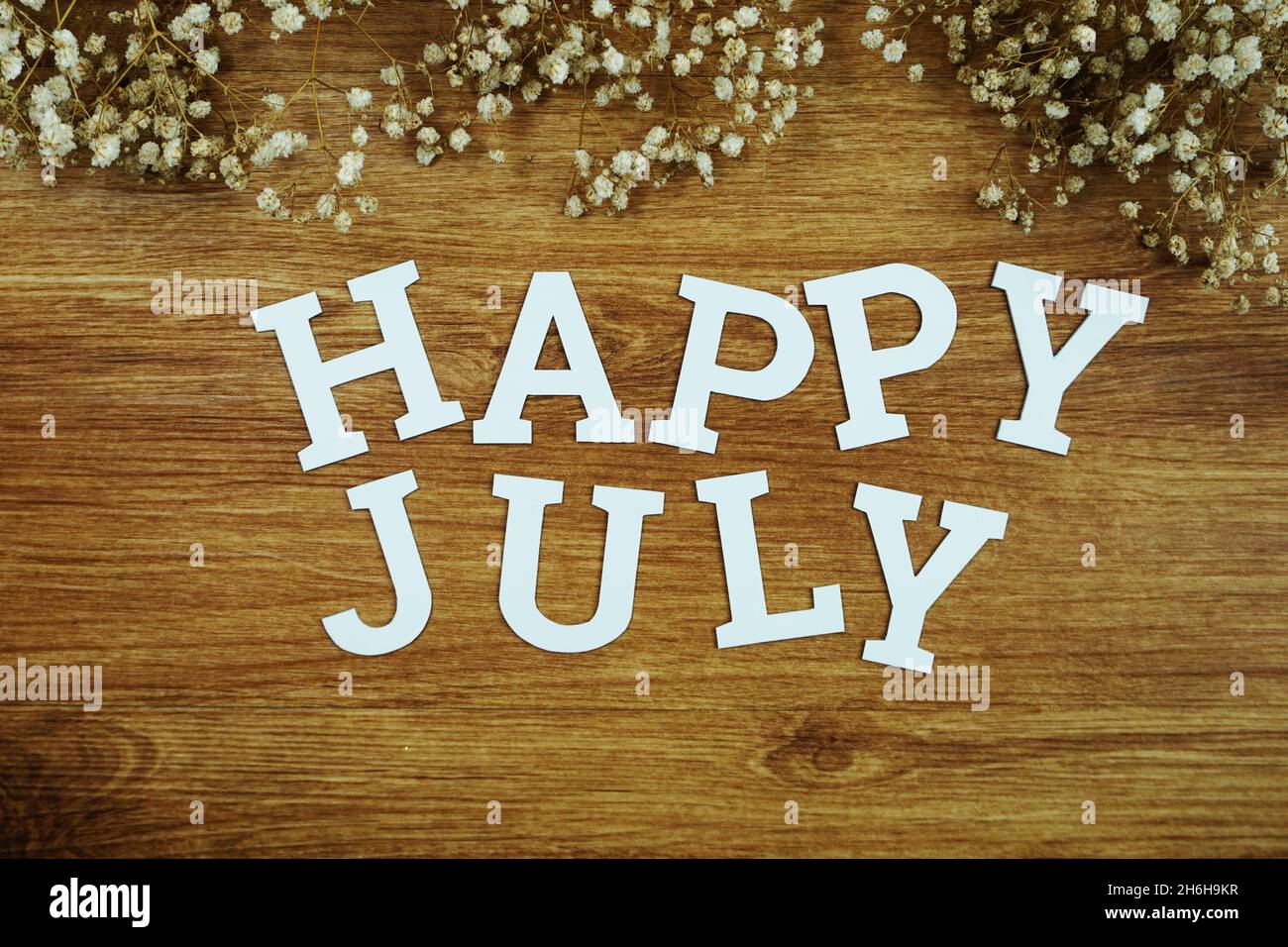 Happy July alphabet letter with space copy on wooden background Stock ...