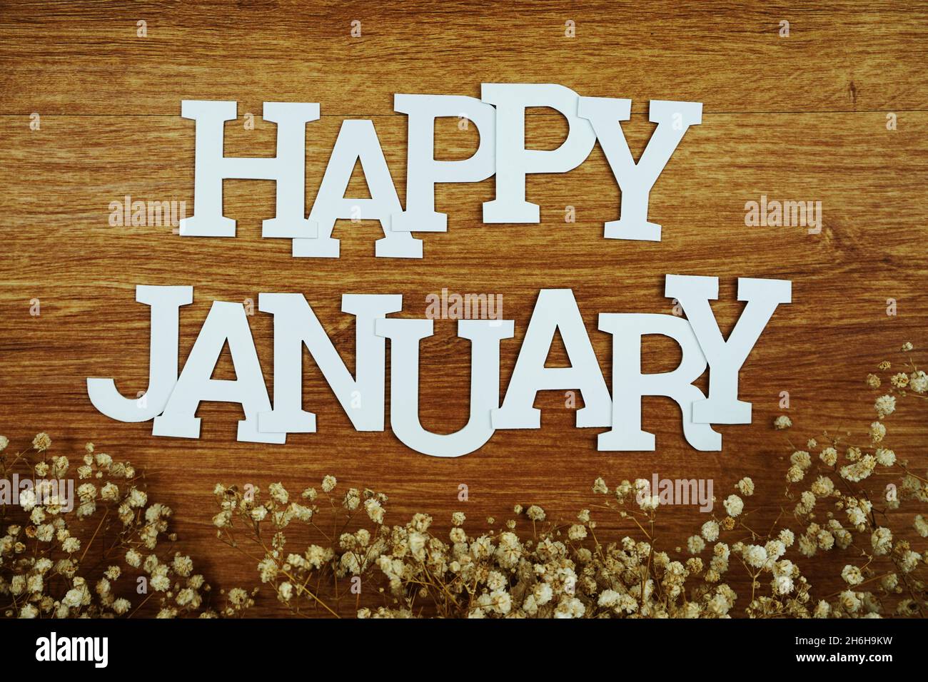 Happy January alphabet letter with space copy on wooden background ...
