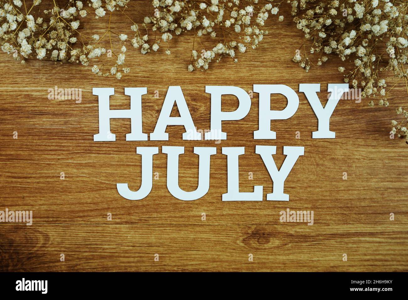 Happy July alphabet letter with space copy on wooden background Stock ...