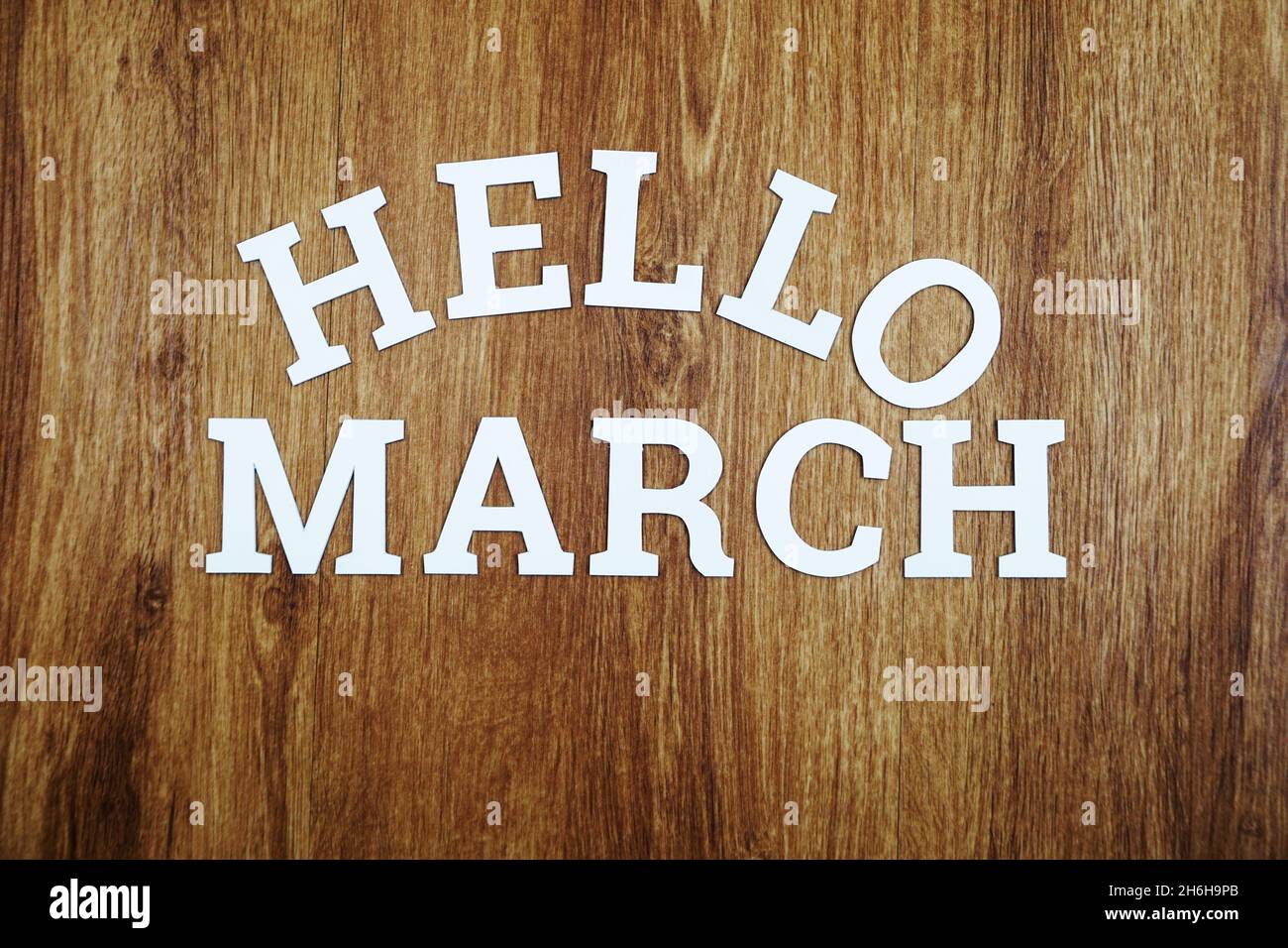 Hello March alphabet letters on wooden background Stock Photo - Alamy