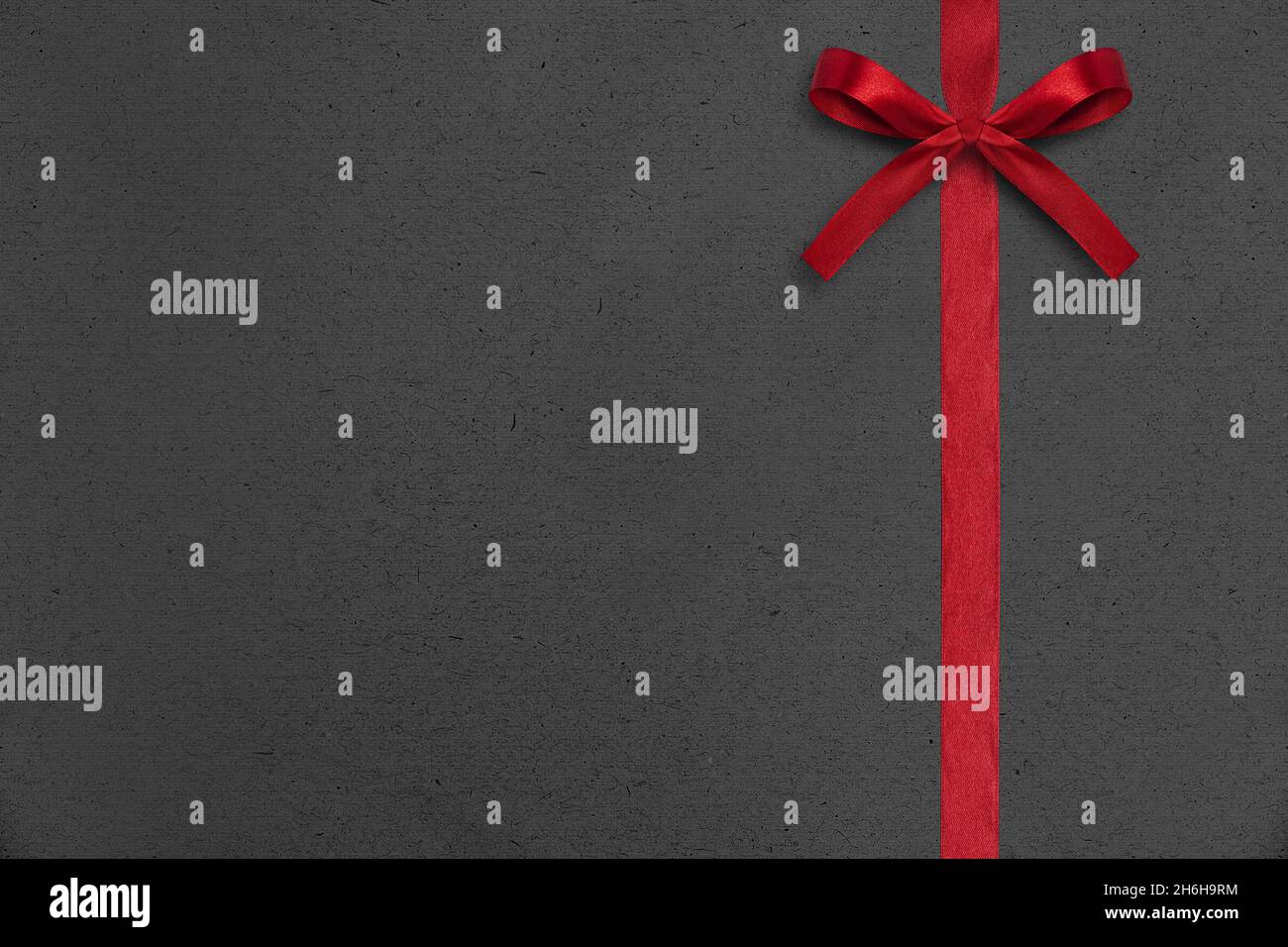 Red ribbon with black background Stock Photo - Alamy