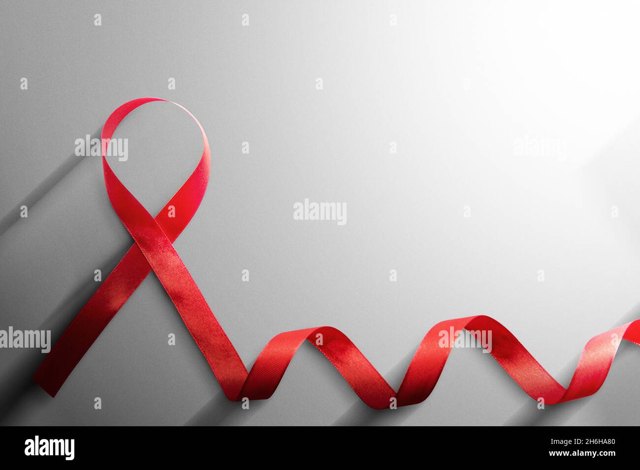 Red ribbon with white background. Hiv Aids ribbon awareness Stock Photo - Alamy