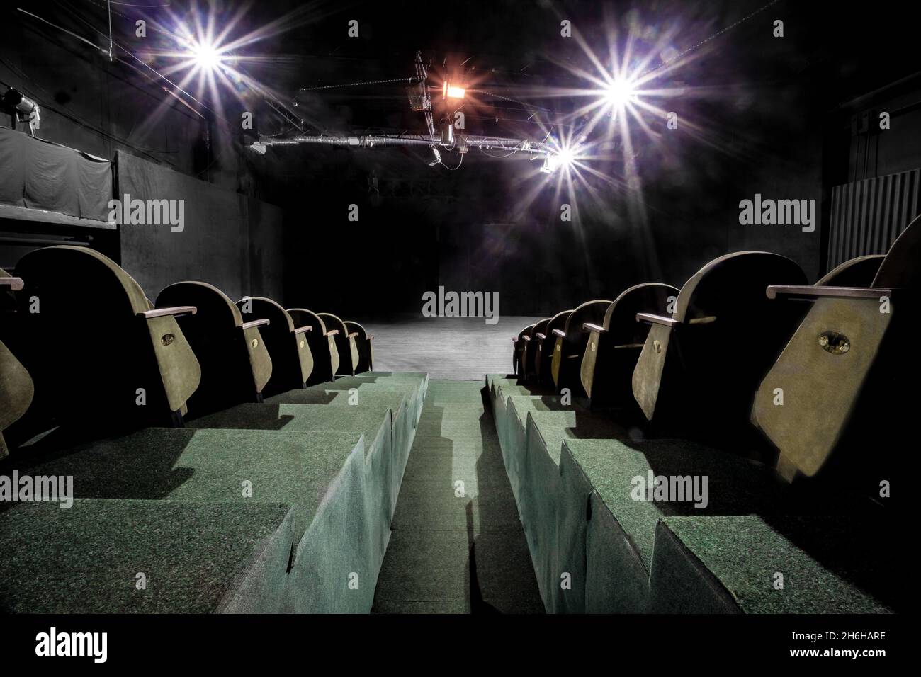 Image of a small auditorium with green armchairs Stock Photo - Alamy